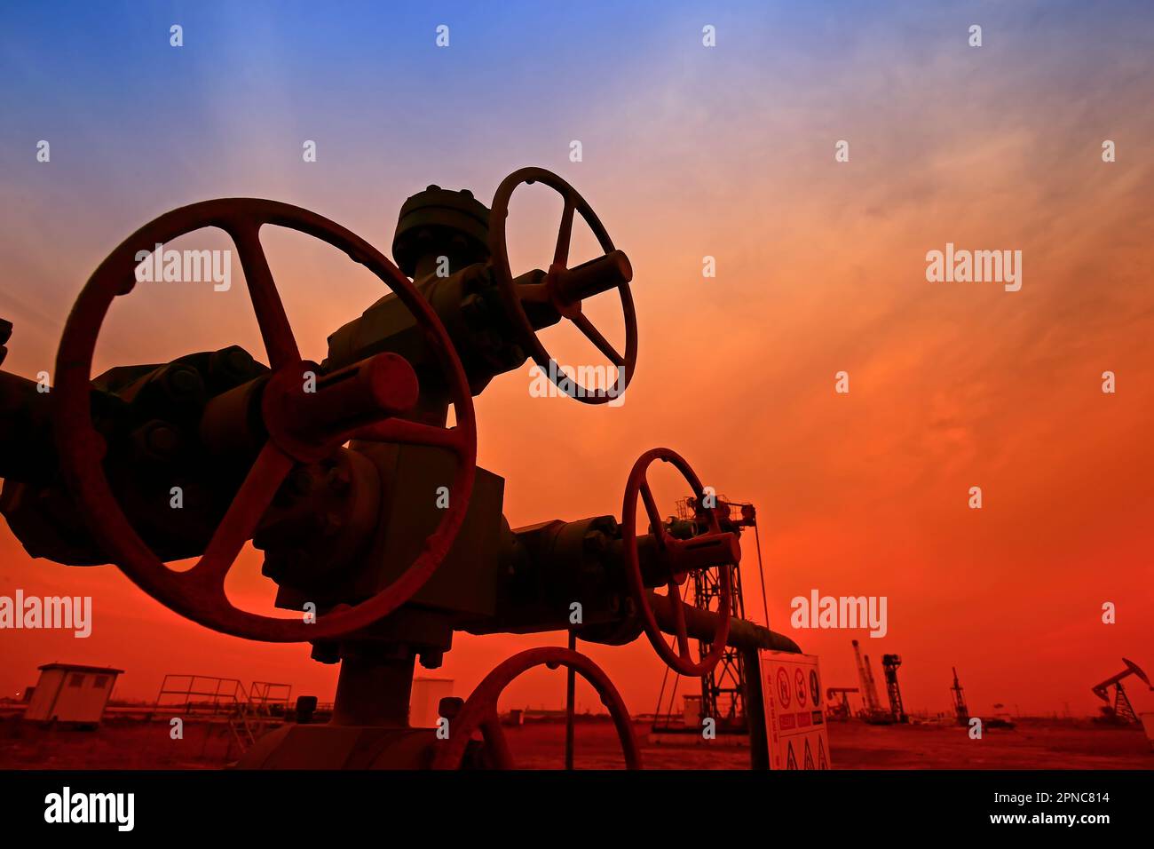 Oil pipes and valves Stock Photo - Alamy
