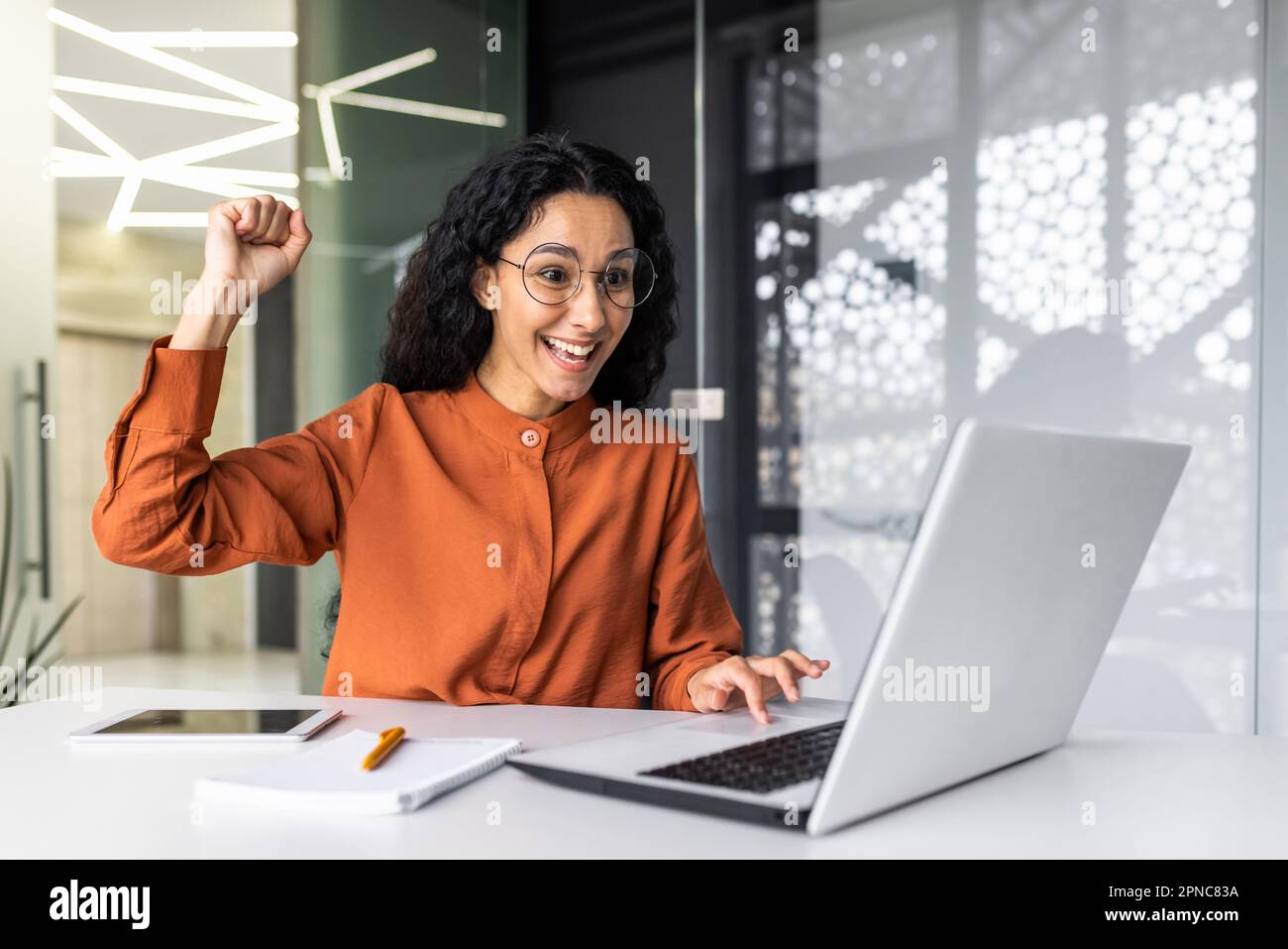 Hispanic business woman celebrating victory success, employee with ...