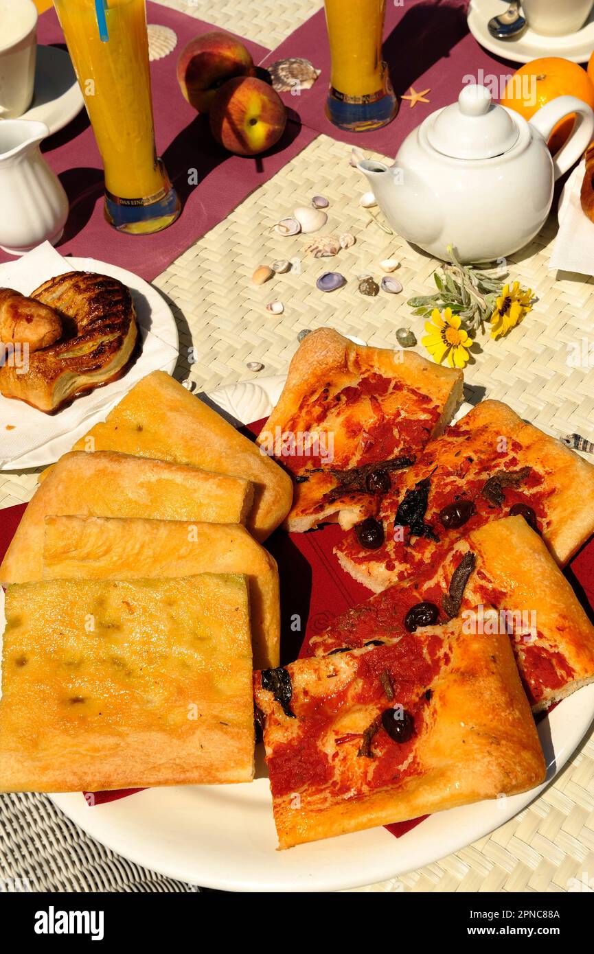 A snack based on focaccia and sardenaria, a typical pizza of the ...