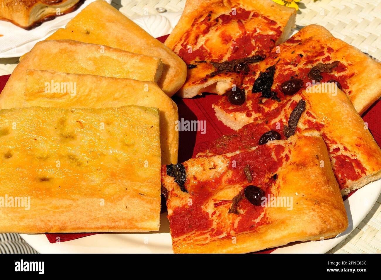 A snack based on focaccia and sardenaria, a typical pizza of the ...