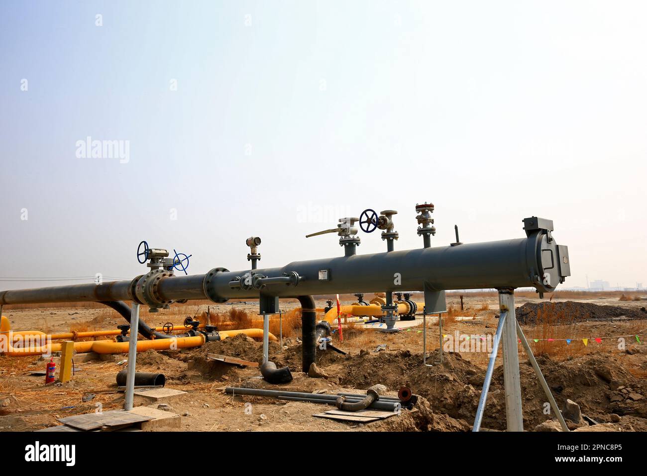 Oil pipes and valves Stock Photo - Alamy