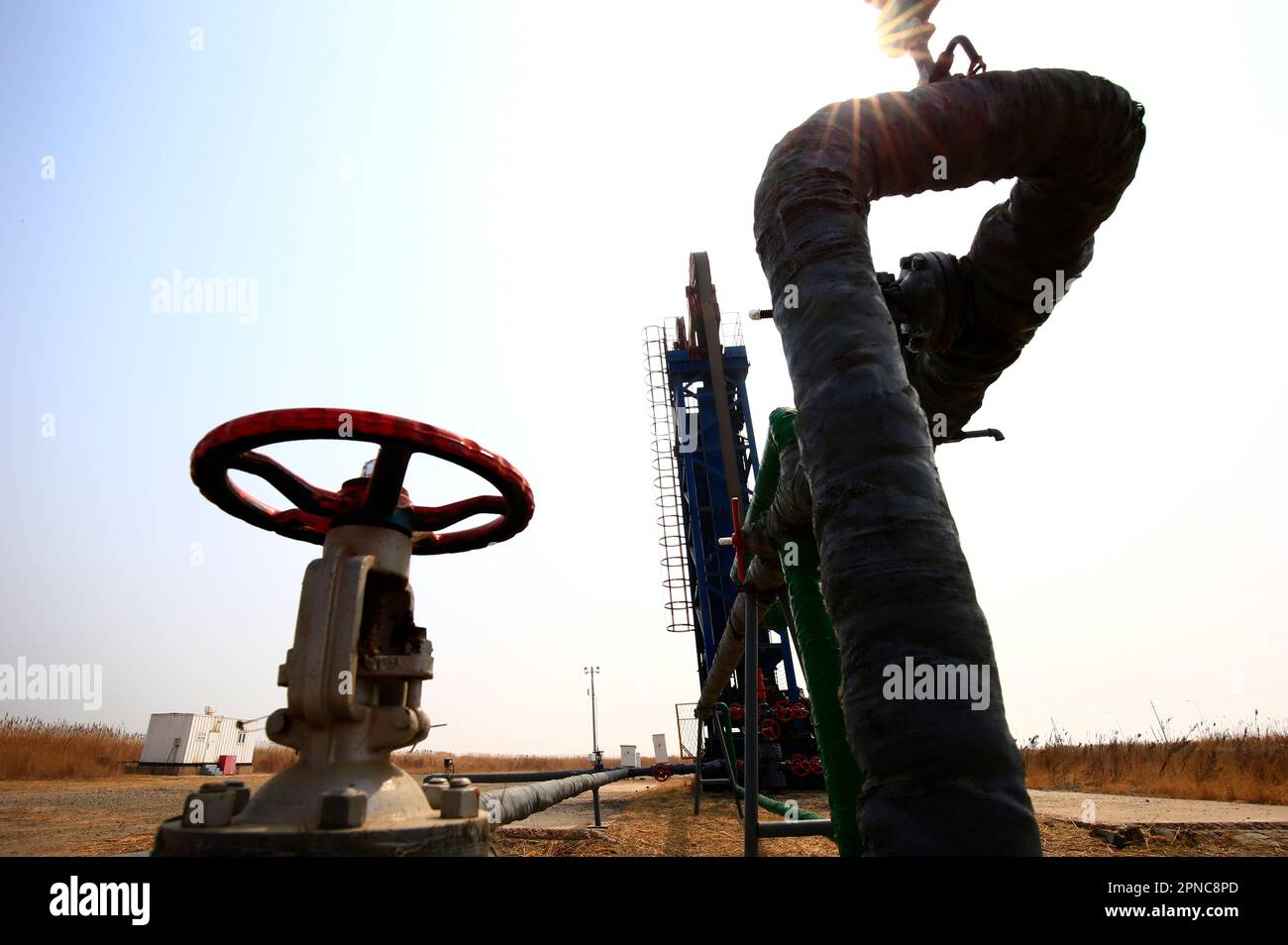Oil pipes and valves Stock Photo - Alamy