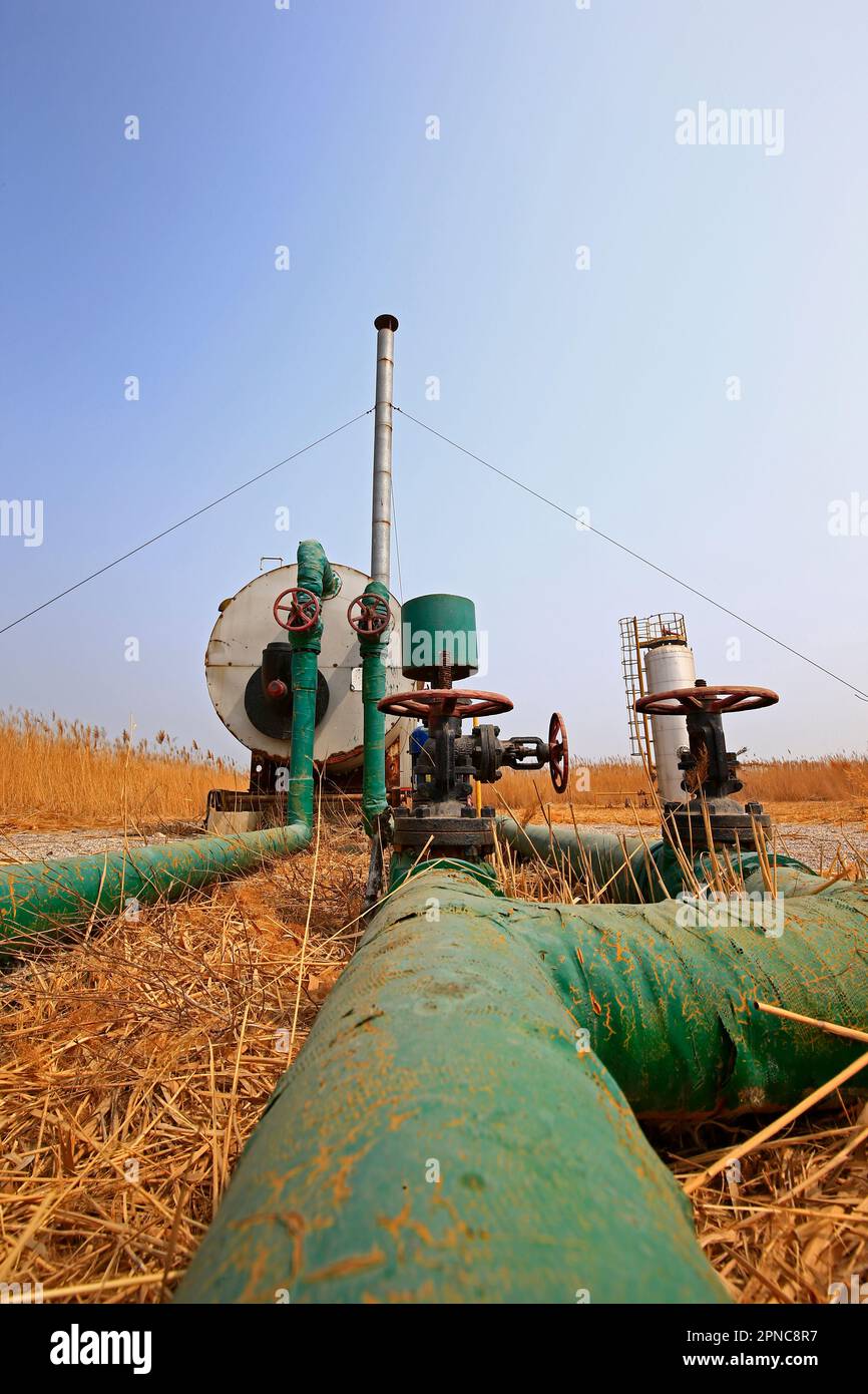 Oil pipes and valves Stock Photo - Alamy