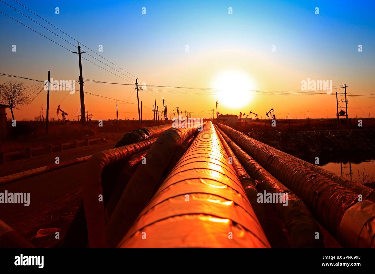Oil pipes and valves Stock Photo - Alamy