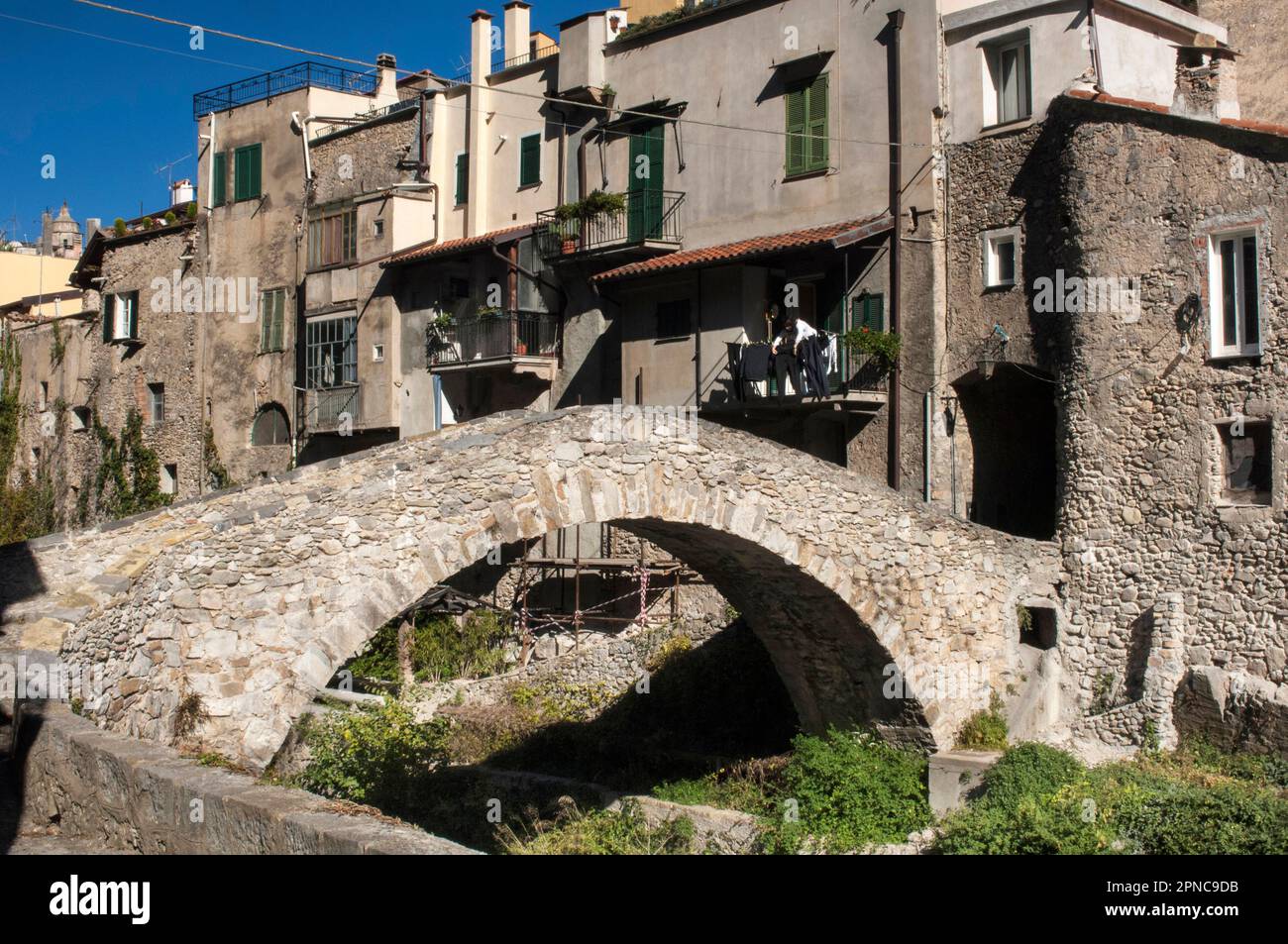 The medieval bridge over the Neva stream in Zuccarello; Savona; Liguria ...