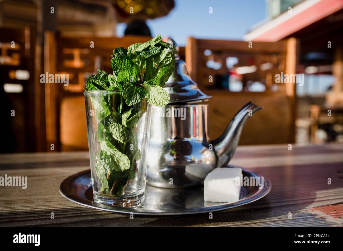 Traditional Moroccan tea pot with a cup outside ready to drink Stock ...