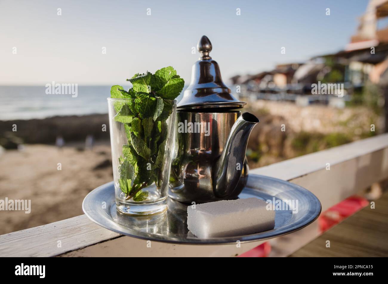 Traditional Moroccan tea pot with a cup outside ready to drink Stock ...