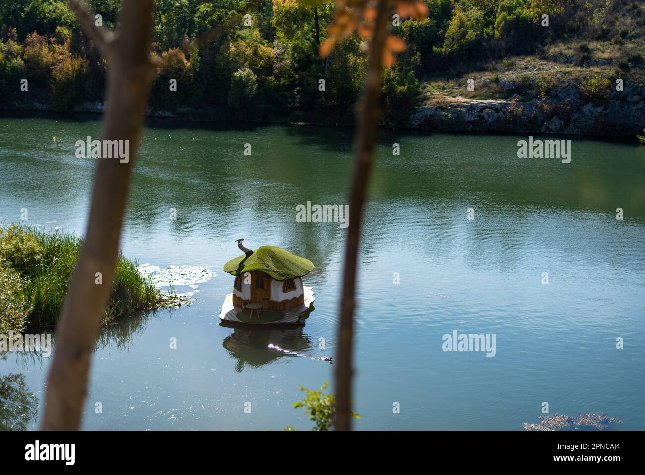 A beautiful scenery of small house in a lake in Golden park (Zlaten ...