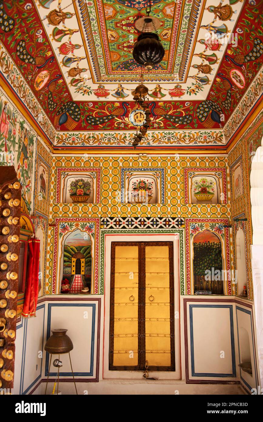 Colorful paintings on the entrance gate of Raghu Nath Ji Mandir ...