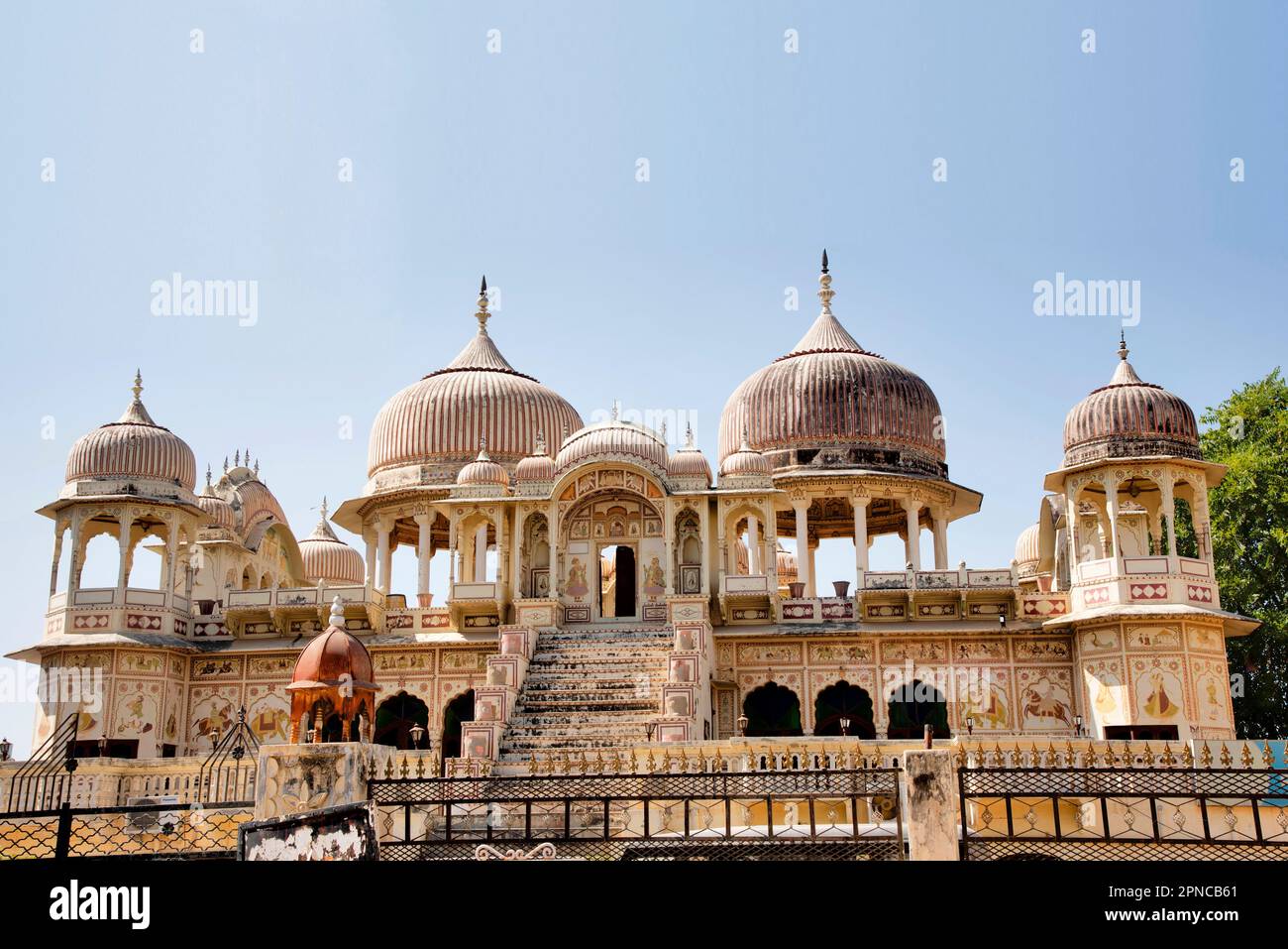 Colorful paintings on the outer wall of an old chhatri, converted in to ...