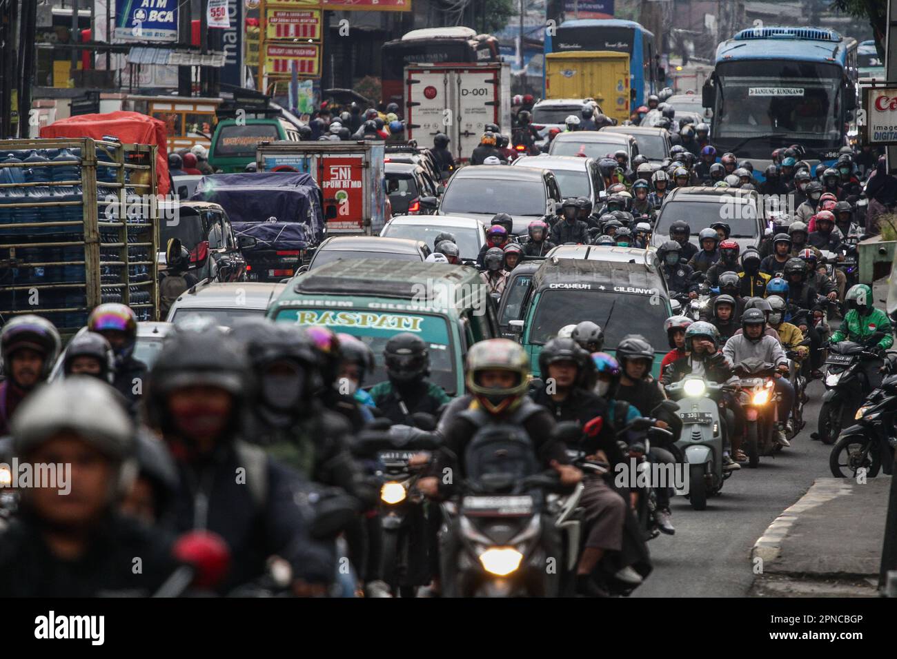 Bandung, West Java, Indonesia. 18th Apr, 2023. Vechiles stuck in a ...