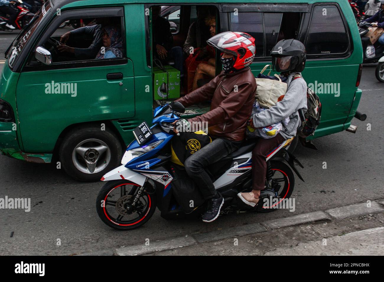 Bandung, West Java, Indonesia. 18th Apr, 2023. A family stuck in a ...