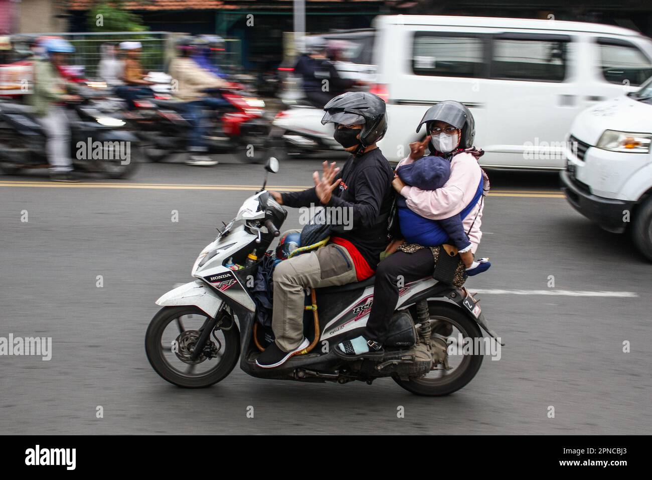 Bandung, West Java, Indonesia. 18th Apr, 2023. A family stuck in a ...