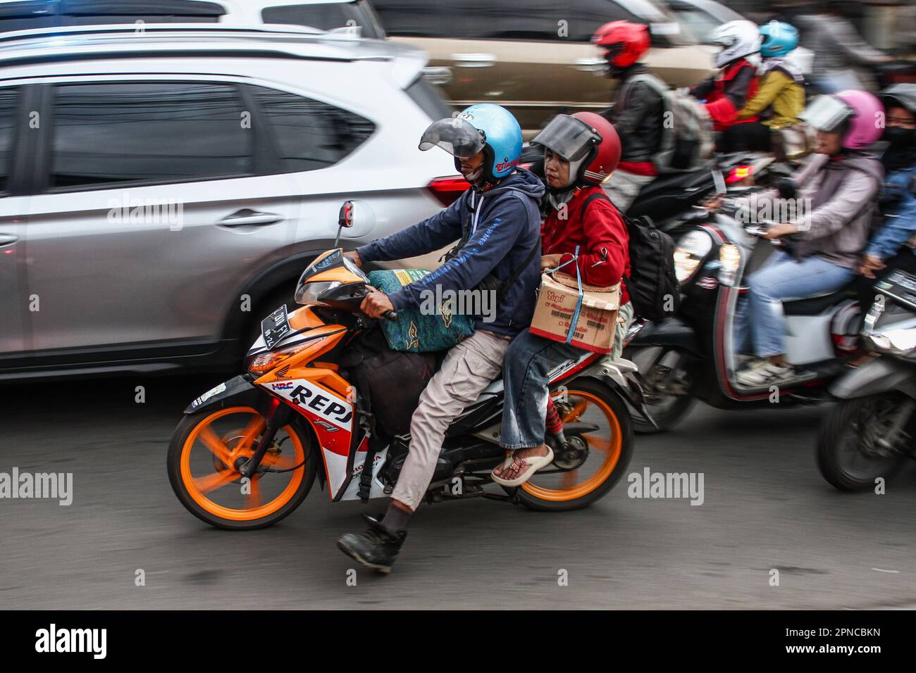 Bandung, West Java, Indonesia. 18th Apr, 2023. A family stuck in a ...