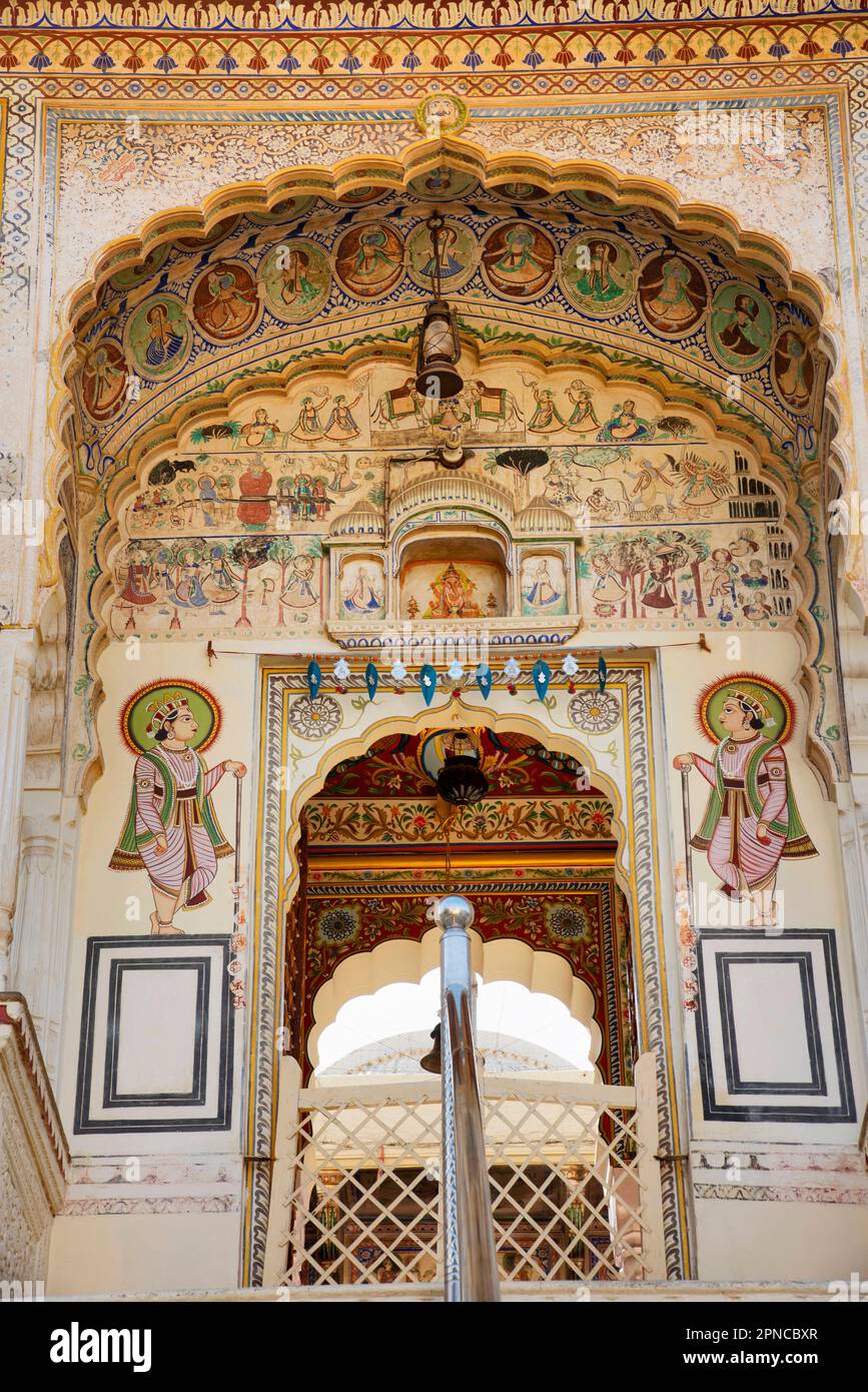 Colorful paintings on the entrance gate of Raghu Nath Ji Mandir ...