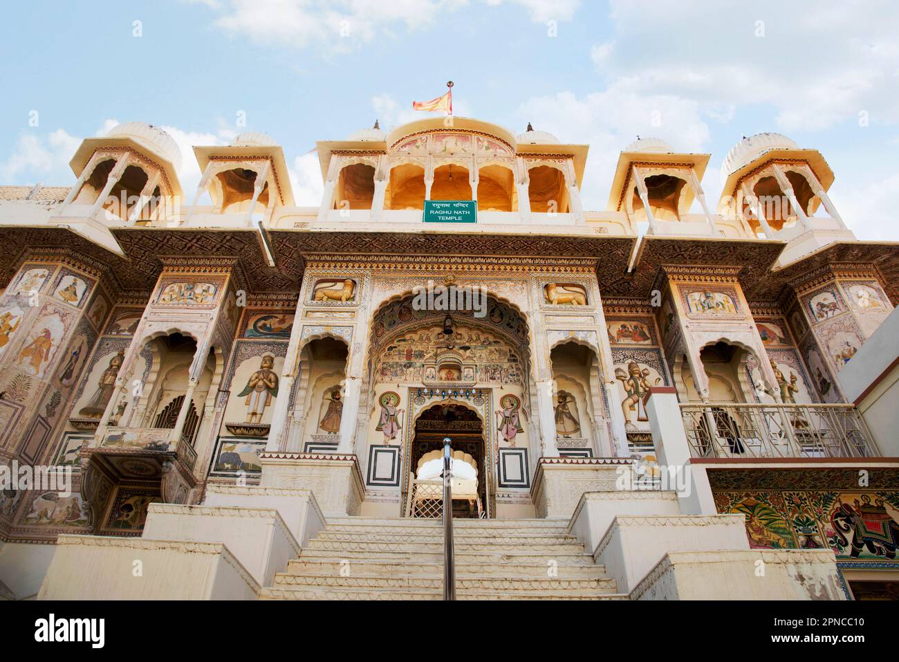 Colorful paintings on the entrance gate of Raghu Nath Ji Mandir ...