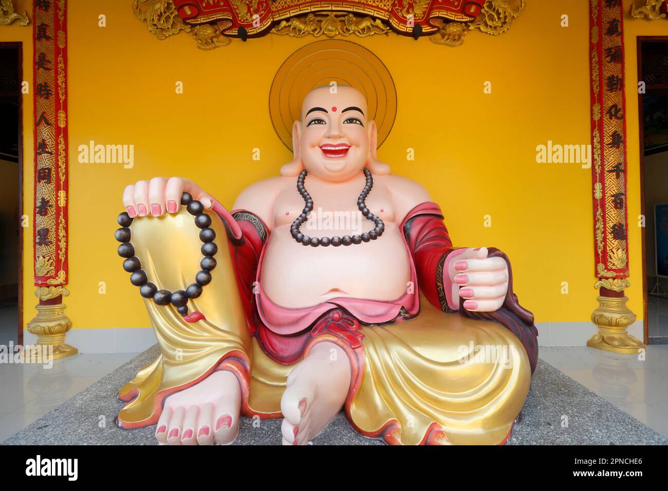 Phu Son Tu buddhist temple. Smiling Buddha or big happy Maitreya Buddha statue. Tan Chau ...