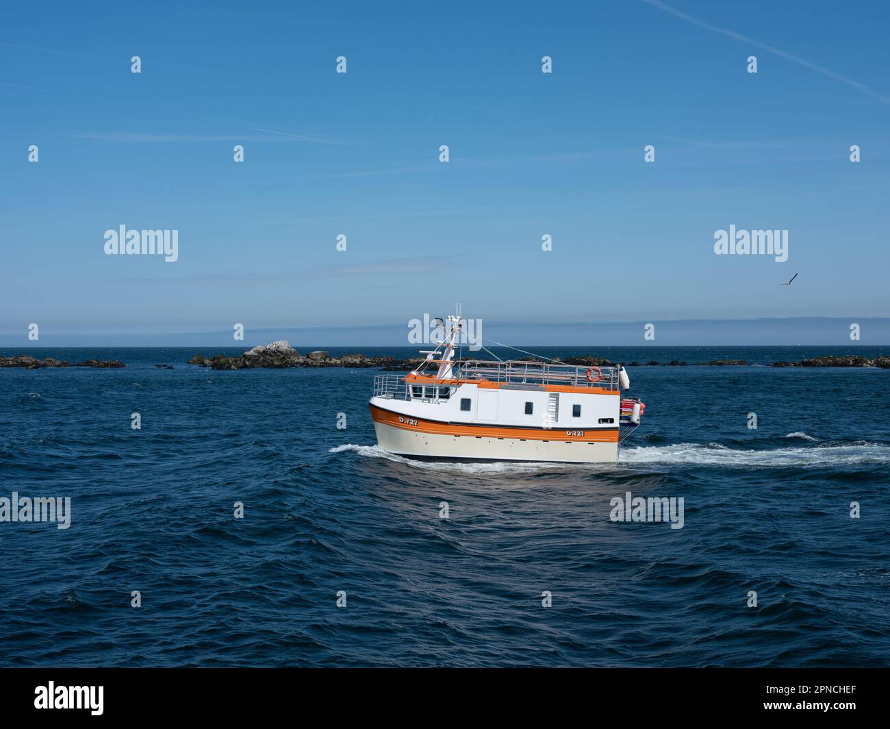 A fishing boat sailing past Dalkey Island, Dublin Stock Photo - Alamy