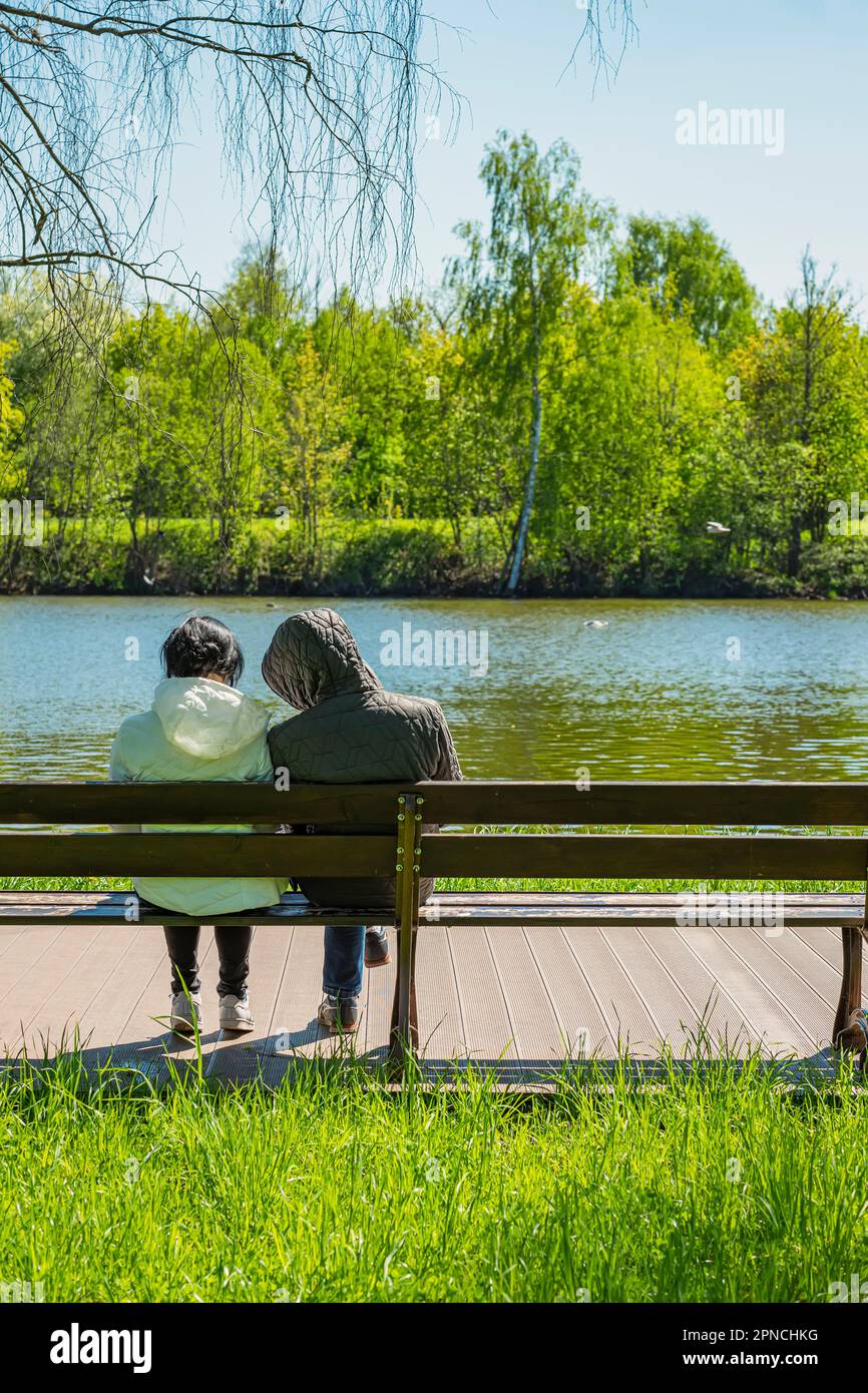 Girl rear view park bench hi-res stock photography and images - Alamy