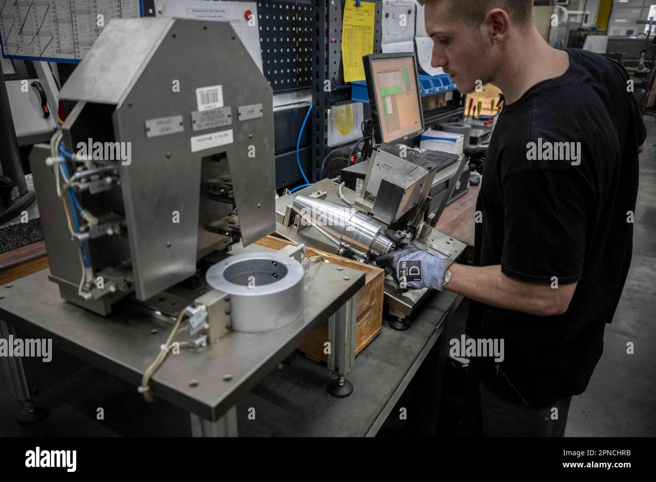 This photograph shows a 155 shell for Cesar gun being manufactured ...