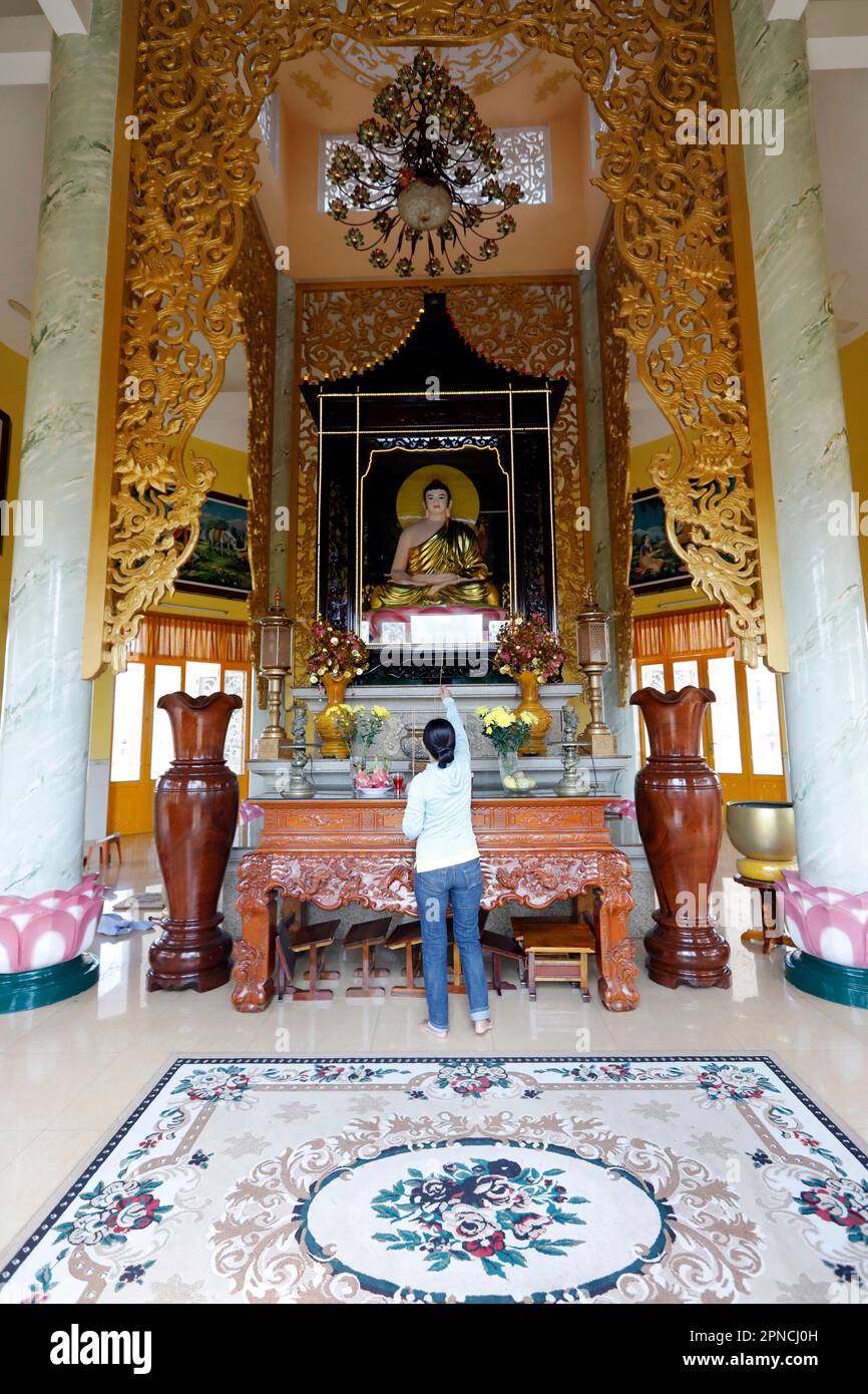 Tinh Xa Ngoc Chau pagoda. Buddhist altar. Woman praying the Buddha. Chau Doc. Vietnam Stock ...