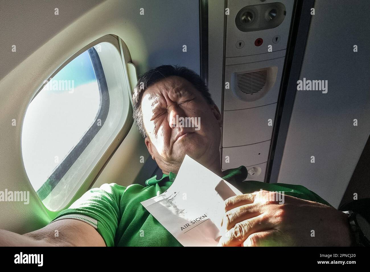 Man vomiting in the aeroplane hi-res stock photography and images - Alamy