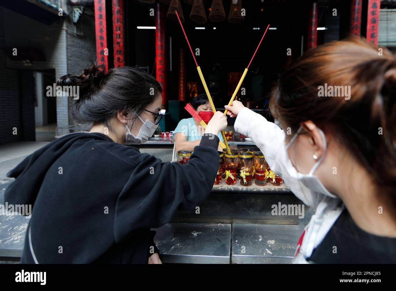The Thien Hau Temple the most famous taoist temple in Cholon. Women ...