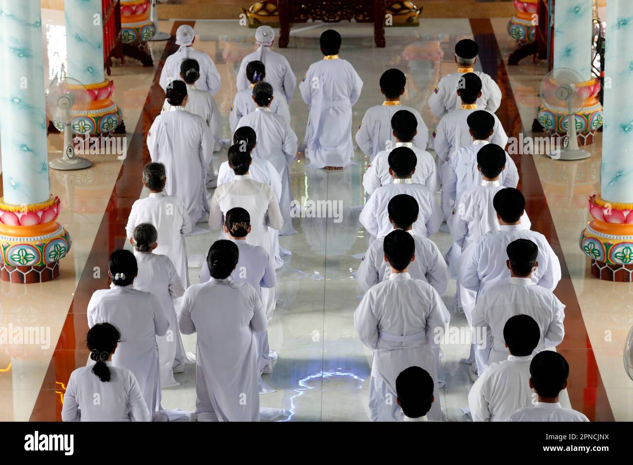 Cao Dai temple. Caodaist worshippers at ceremony. Tan Chau. Vietnam ...