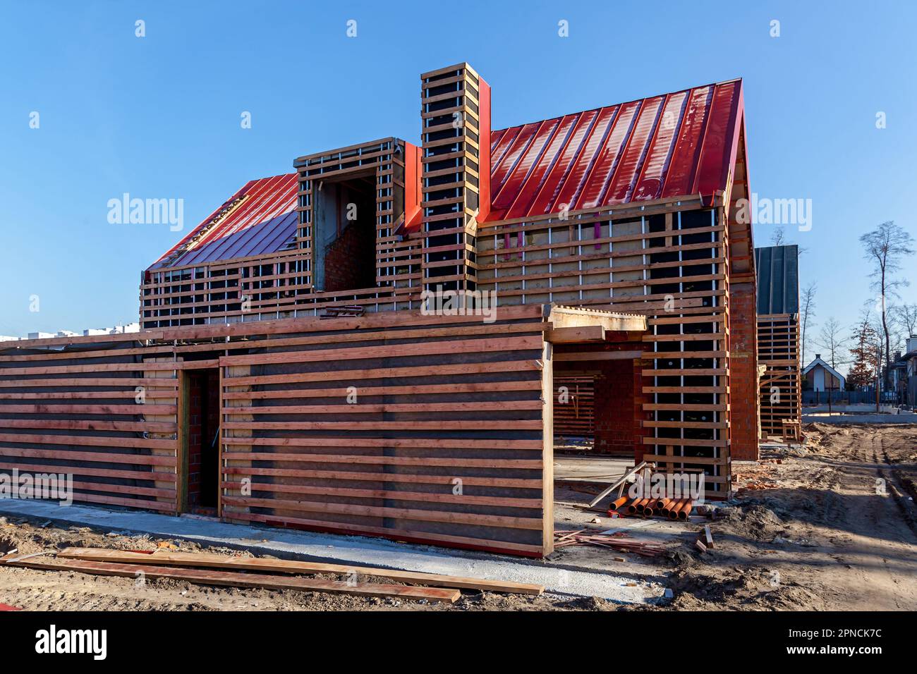 Brick house with a wooden frame for sheathing with metal siding ...