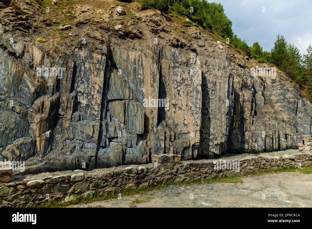 A section of a mountain with visible layers of beautiful stone rock ...