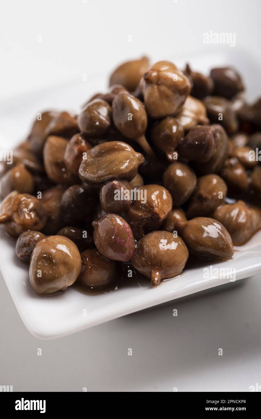 Sicilian capers in oil in a small white bowl, Sicily, Italy Stock Photo ...
