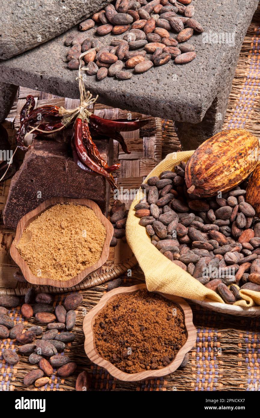 A still life with an ancient stone Metate (A flat stone with a slightly ...
