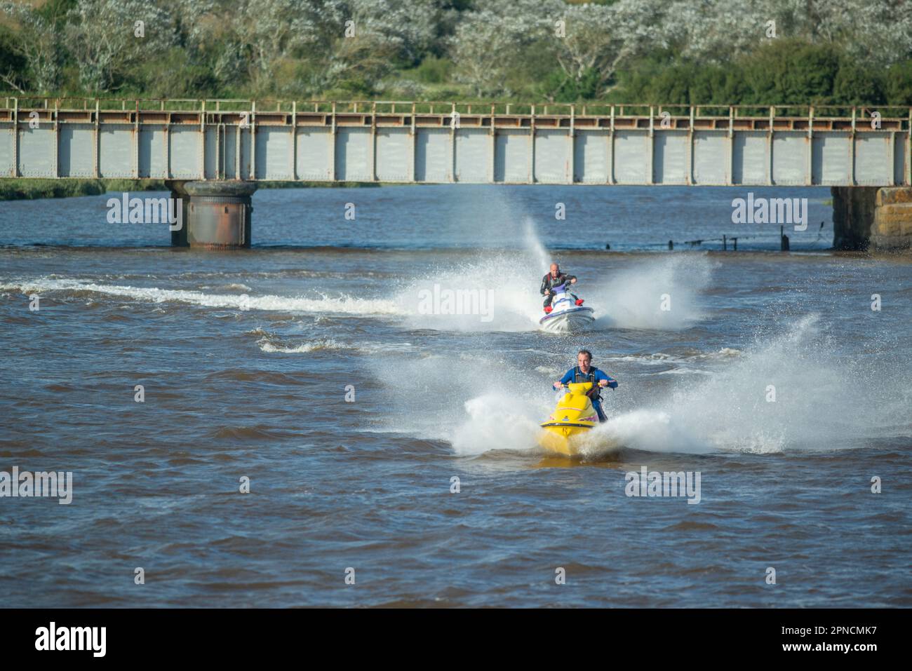 Two men on jetskis at Kidwelly Quay which is an area rich in bird life ...