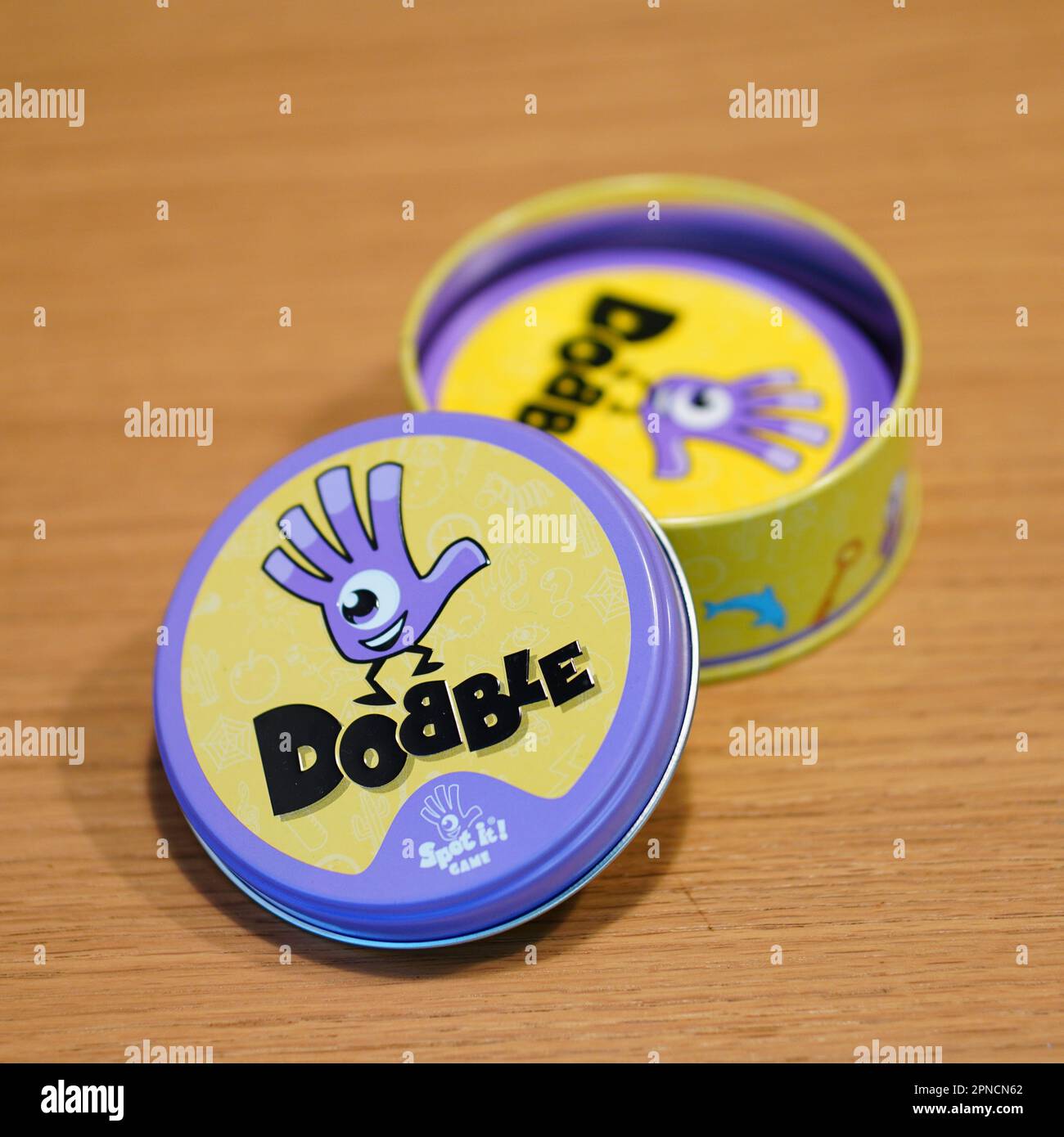 Two small tins featuring a doodled label on their backs Stock Photo - Alamy