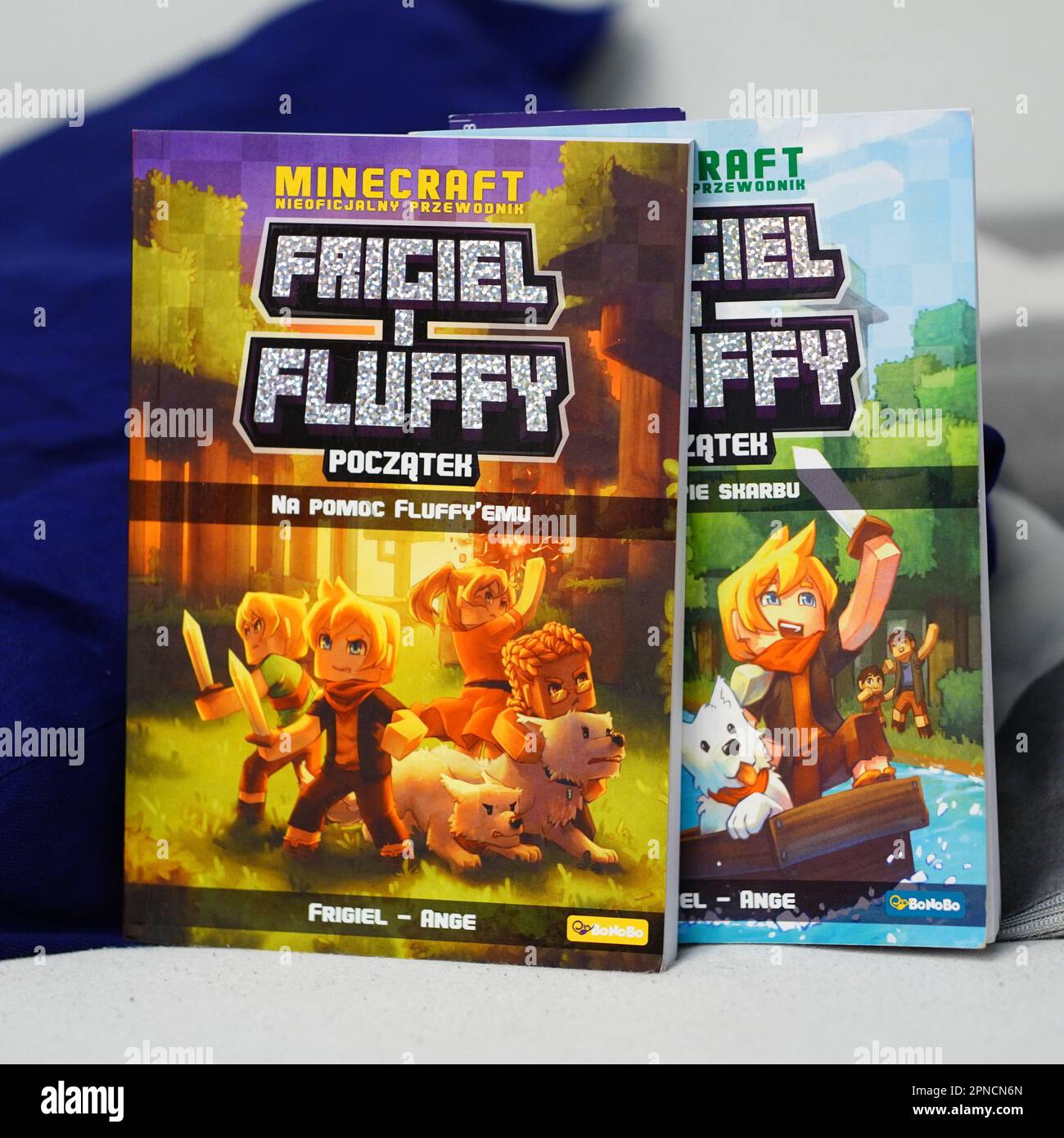 Two DVDs are arranged side-by-side on a couch Stock Photo - Alamy