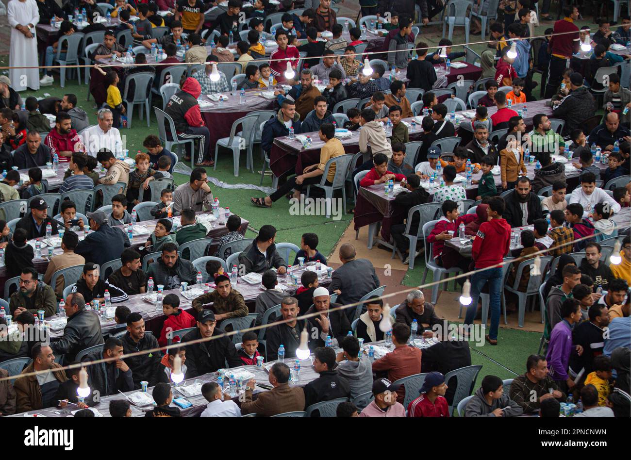 Gaza, Palestine. 17th Apr, 2023. Palestinian families eat a communal ...