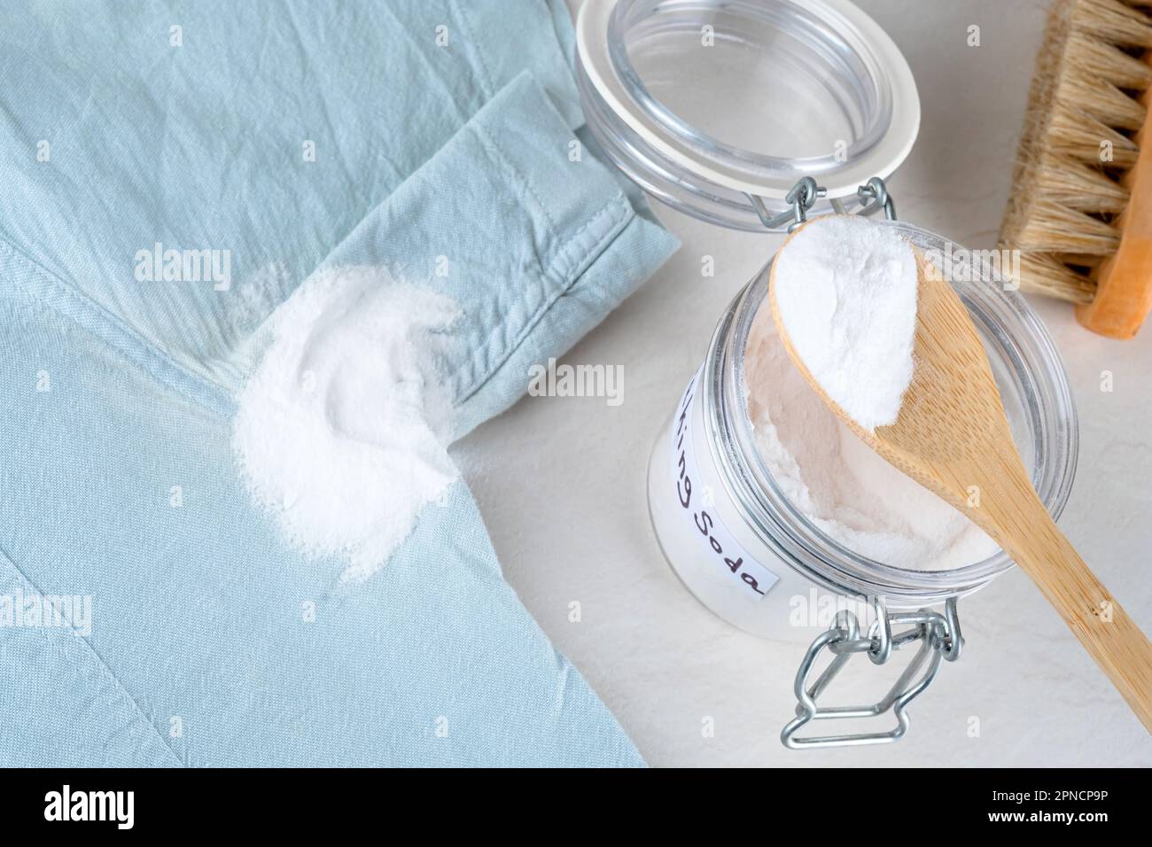 Homemade cleaning sweat stains the armpits on a T-shirt. Homemade green ...