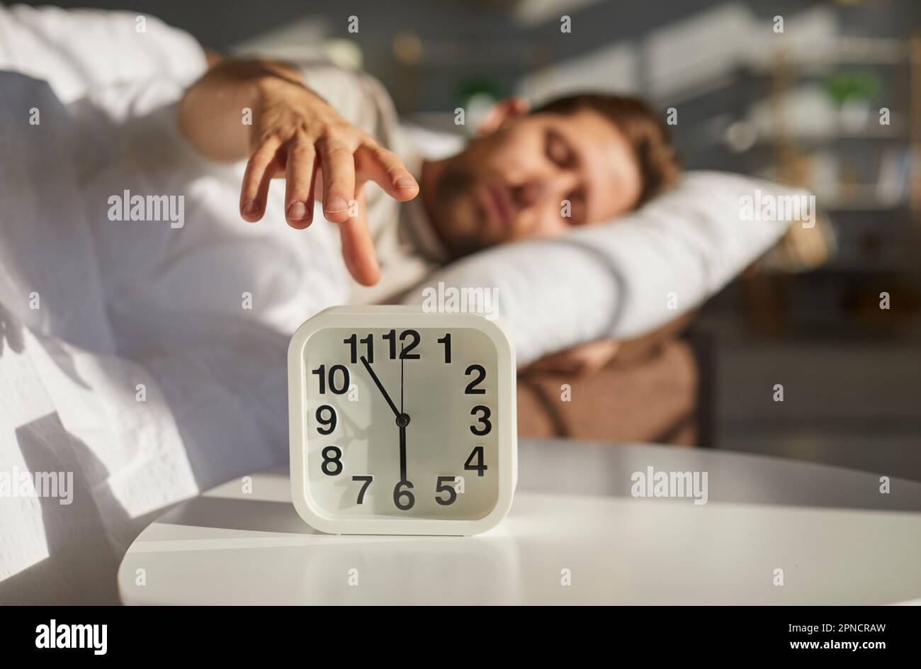 Man alarm clock switch off hi-res stock photography and images - Alamy