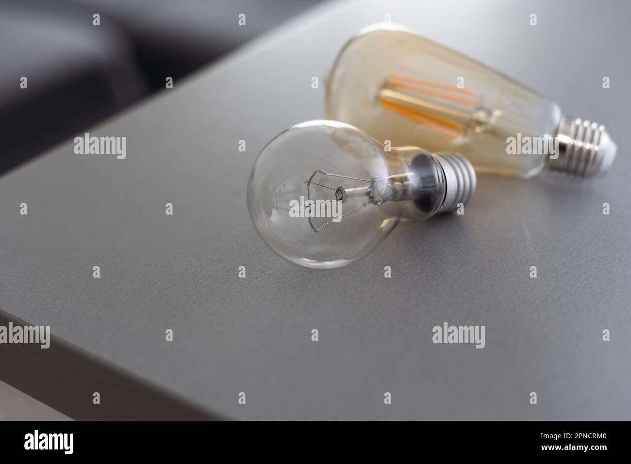 Alternative technology concept . Bulb and Fluorescent bulb comparing ...
