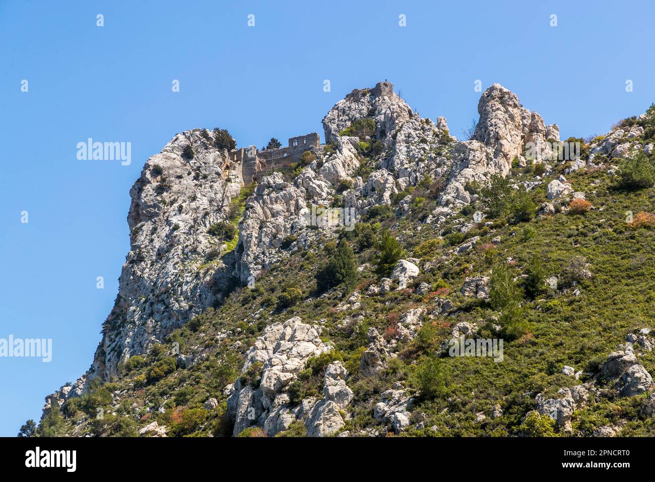 View of the high castle St Hilarion, 700 meters high built on rugged ...