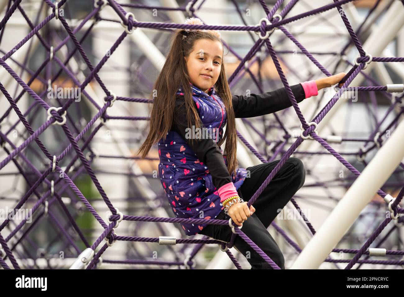little girl in a rope maze Stock Photo - Alamy