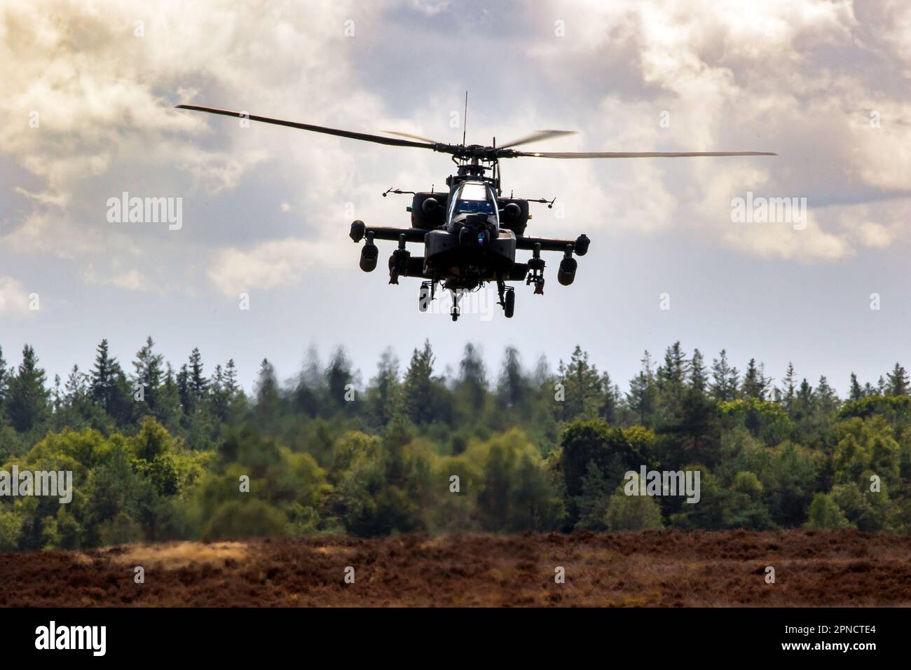 Boeing AH-64 Appache attack helicopter hovering. Veluwe, The Netherlands - September 17, 2022 ...