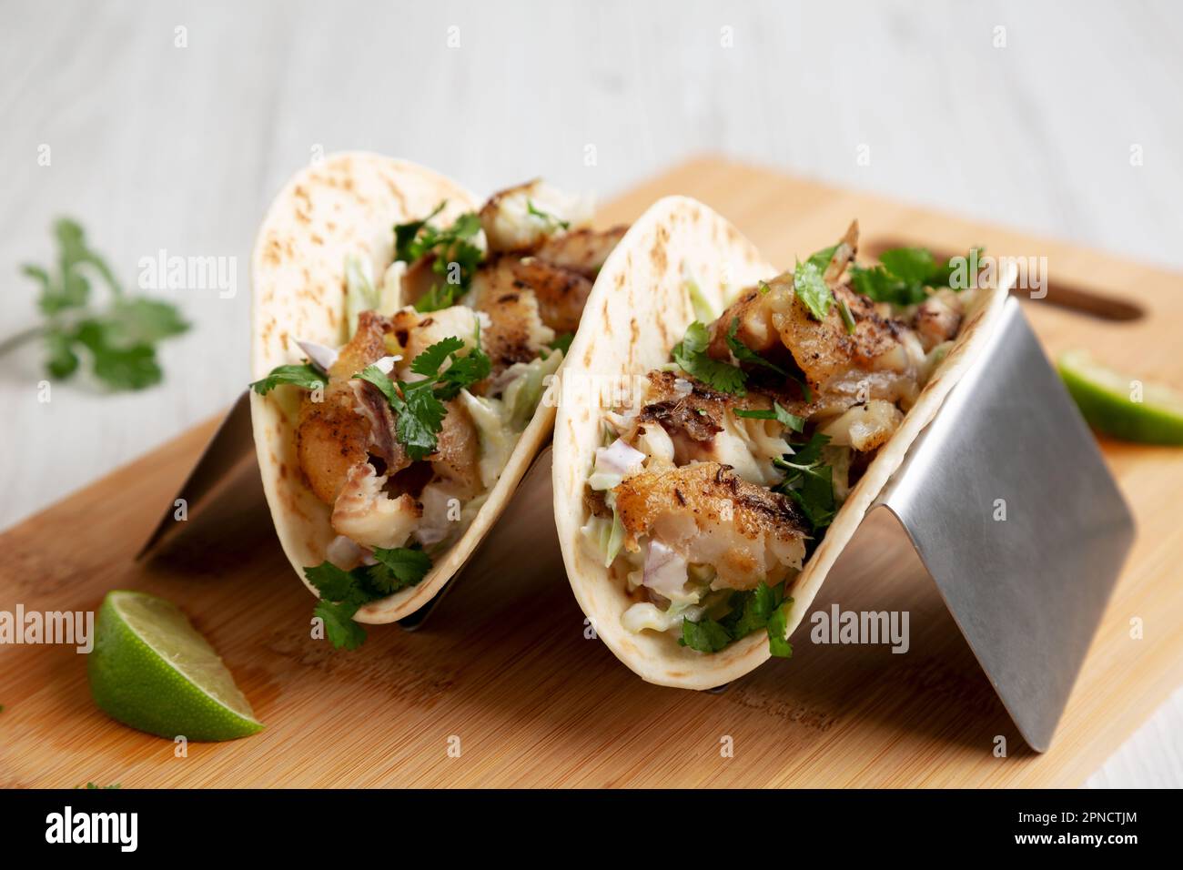 Homemade Fresh Fish Tacos, side view. Close-up Stock Photo - Alamy