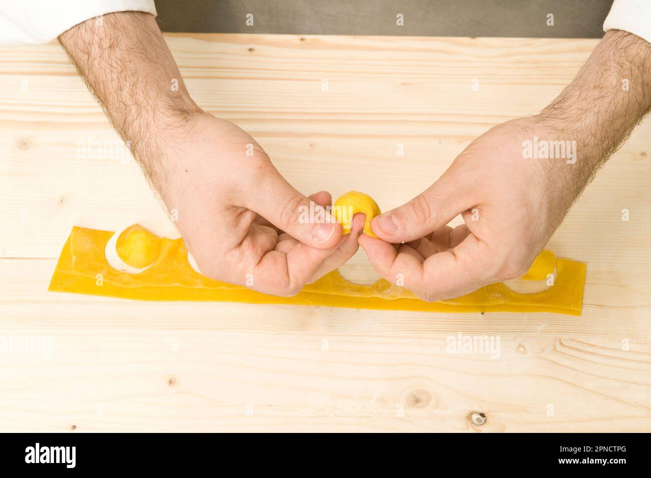 Making Tortelli from fresh pasta by hand. Italy Stock Photo - Alamy