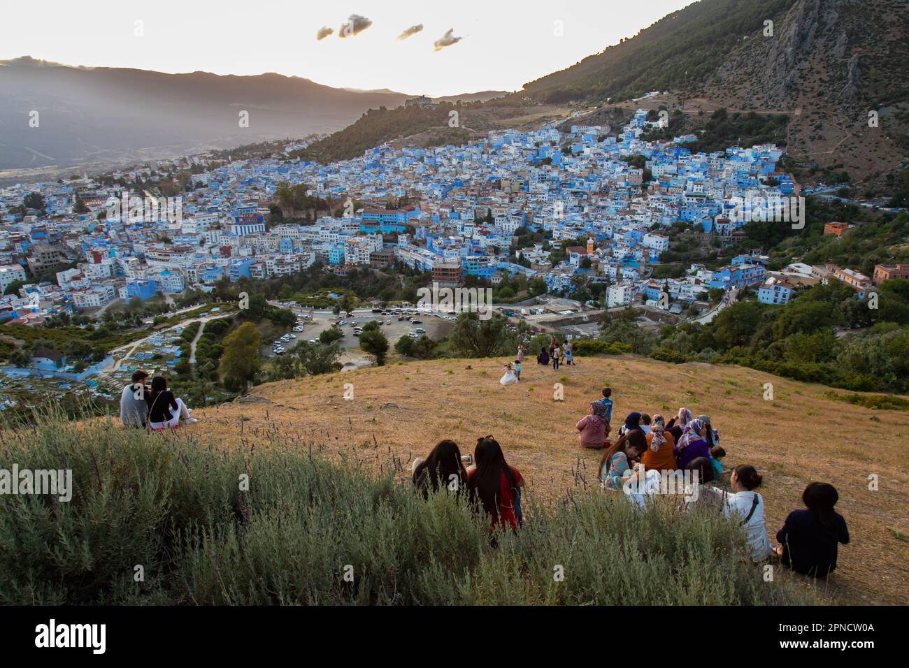 Chefchaouen, Morocco 2022: people wathching sunset on the hill ...