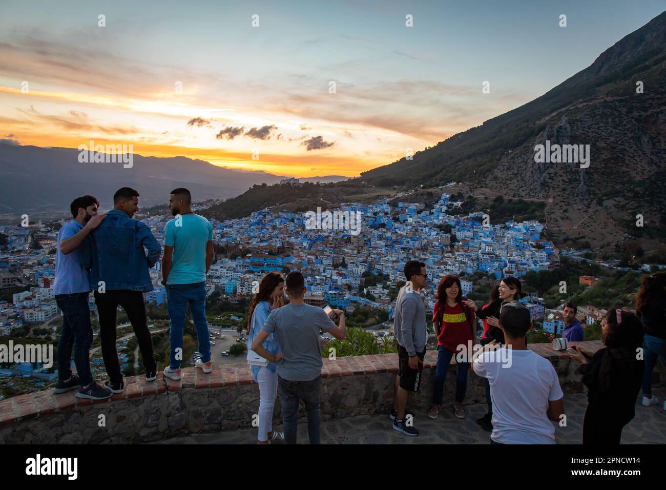 Chefchaouen, Morocco 2022: people wathching sunset on the hill ...