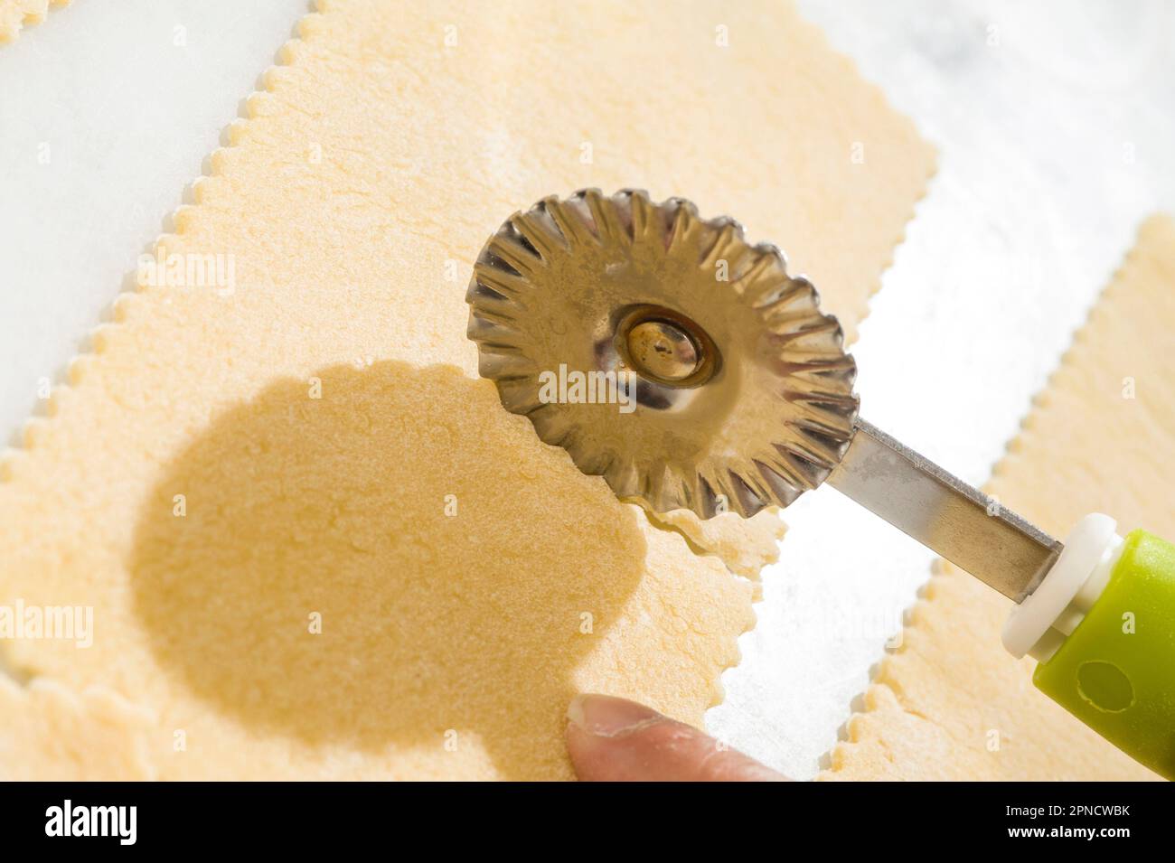 Working with fresh handmade pasta Pansoti, typical of Liguria. Italy ...