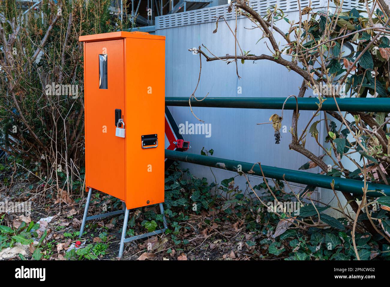 Orange electrical switch cabinet with padlock. Closed Stock Photo - Alamy