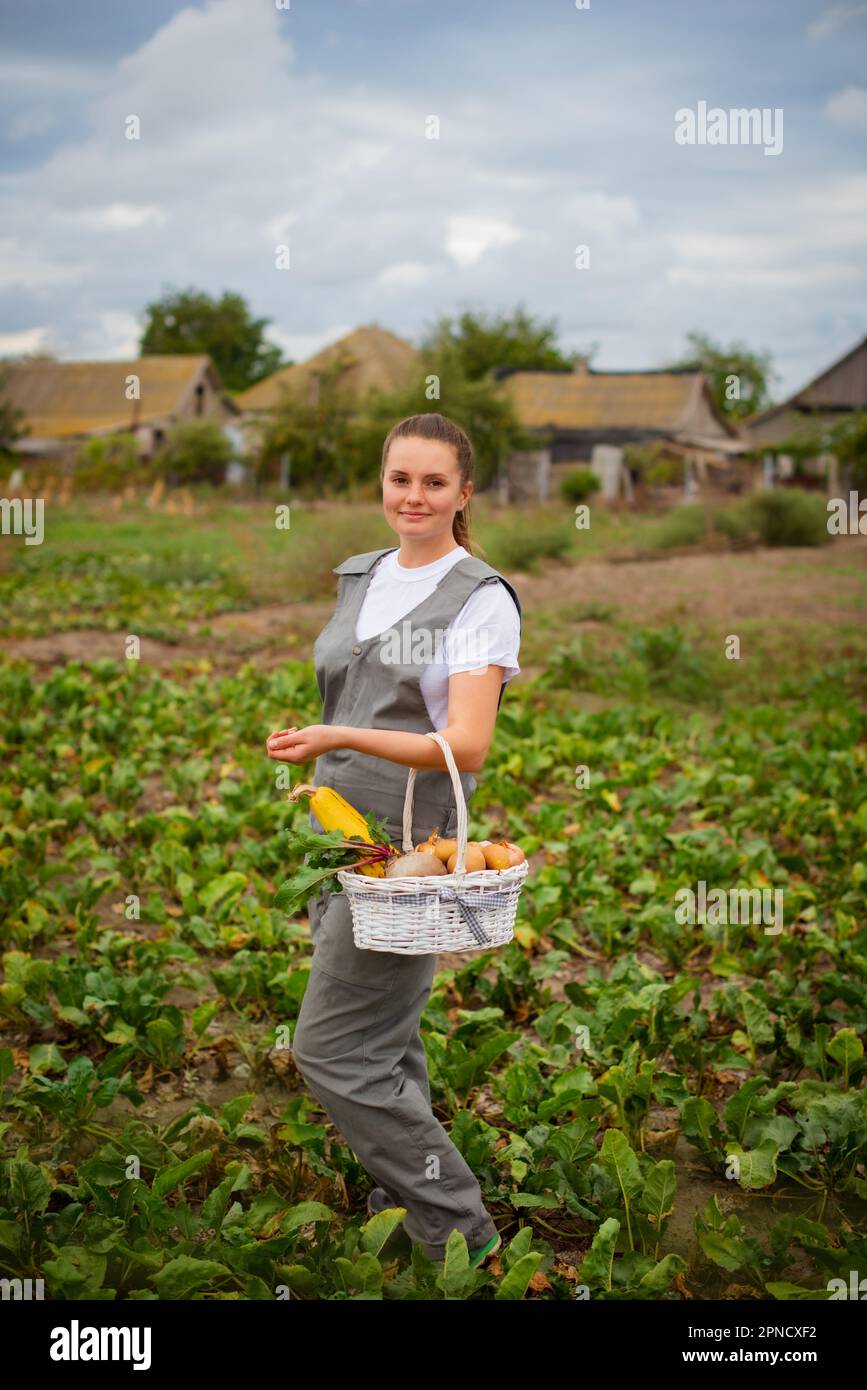 Farm woman overalls vegetables hi-res stock photography and images - Alamy
