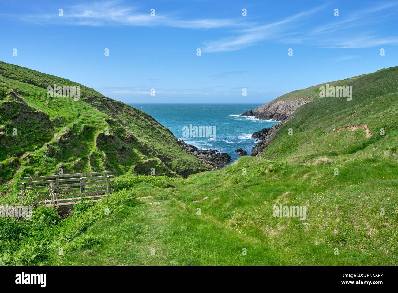 The Wales Coast path leading over a clifftop stream on the Llyn ...